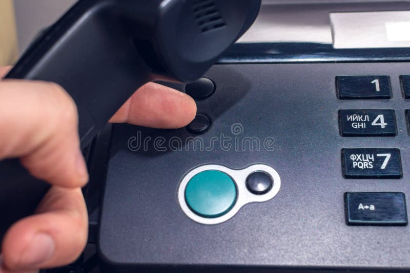 The Hand of an Office Worker Holds the Phone Receiver and Presses the ...