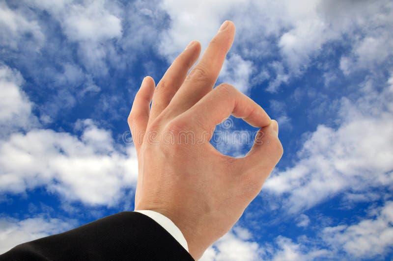 Hand Okay Sign in the Sky stock image. Image of outstanding - 9435213