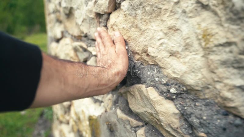 Hand and Old Stone Wall with Texture and Texture. Hand Touching Ancient ...