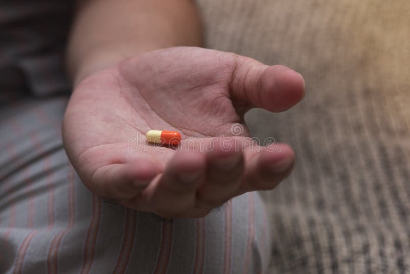 A Hand with One Capsule of Drug Stock Photo - Image of addiction, left ...