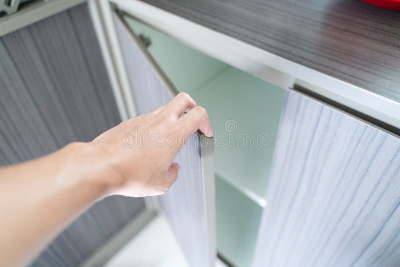 Hand Open Cabinet stock image. Image of doors, household - 135145787
