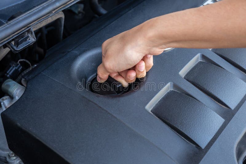 Hand Open the Engine Oil To Prepare for Replacement Stock Photo - Image ...