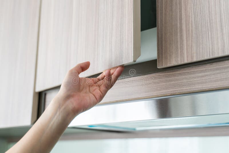 Hand Open Kitchen Cabinet stock photo. Image of furniture - 127579238