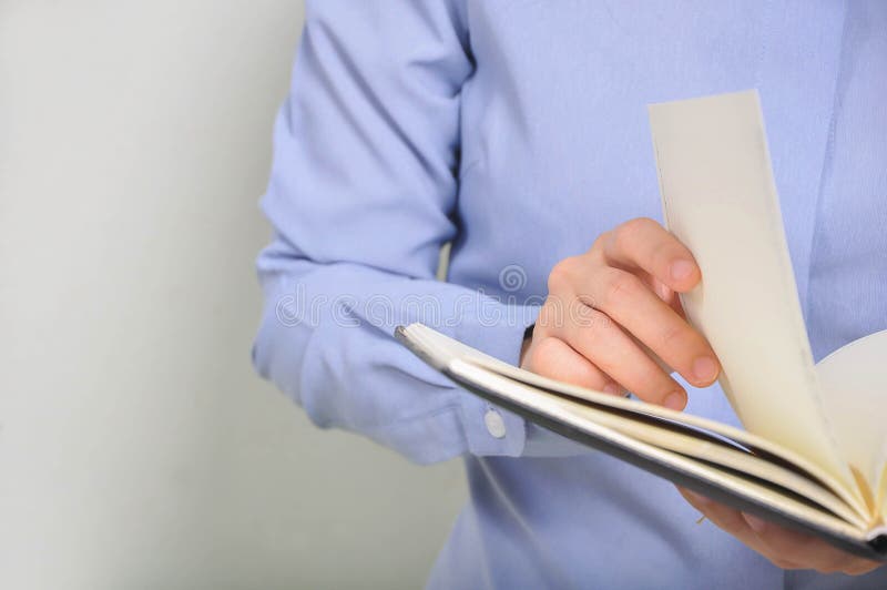 Hand opening books. stock photo. Image of learn, work - 56876826