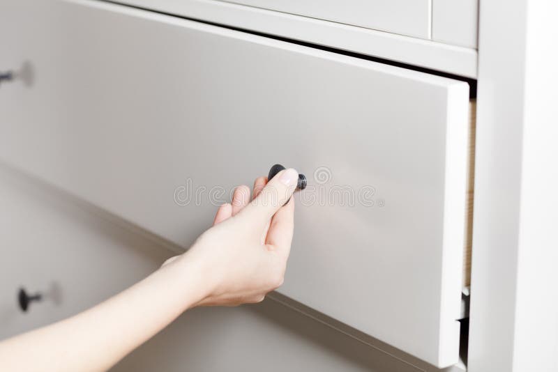 Hand opening a drawer stock photo. Image of closeup, wooden - 30457832