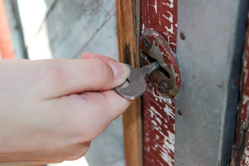 Hand Opening the Key Lock in the Old Door Stock Photo - Image of ...