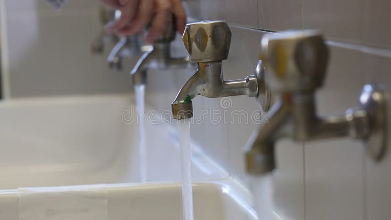 Water from the Taps Flows into a Transparent Container. Stock Video ...
