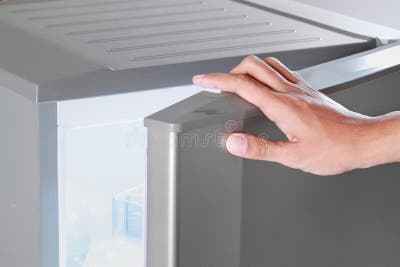 Hand opening refrigerator stock image. Image of clean - 21071371