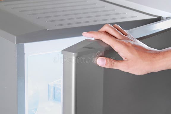 Hand opening refrigerator stock image. Image of clean - 21071371