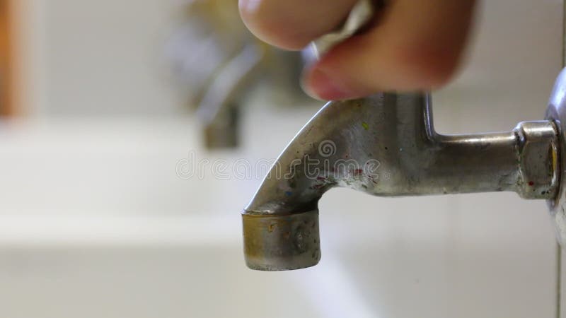 Hand Opening a Tap To Drain Drinking Water Stock Video - Video of taps ...