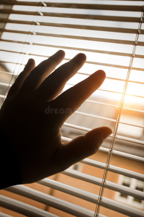 Hand opening window blinds stock image. Image of discover - 112605373