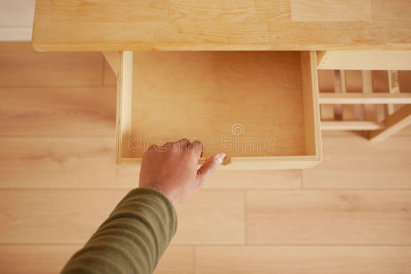 Hand Pulling Open a Wooden Drawer in a Light-filled Room Stock Image ...
