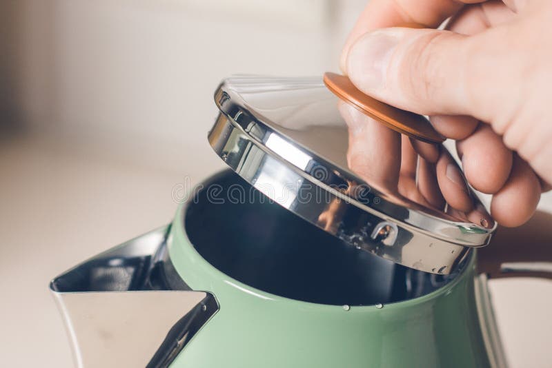 Hand Opens the Lid of the Electric Kettle Stock Image - Image of ...