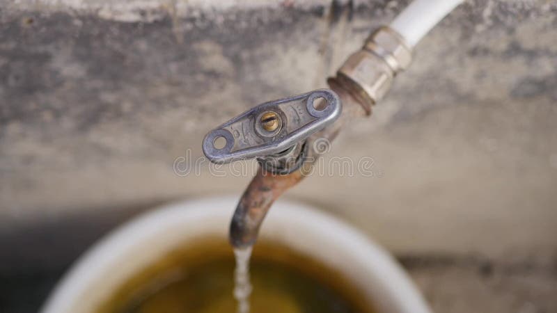 A Man Opens a Valve on a Hot Water Radiator in an Apartment or House ...