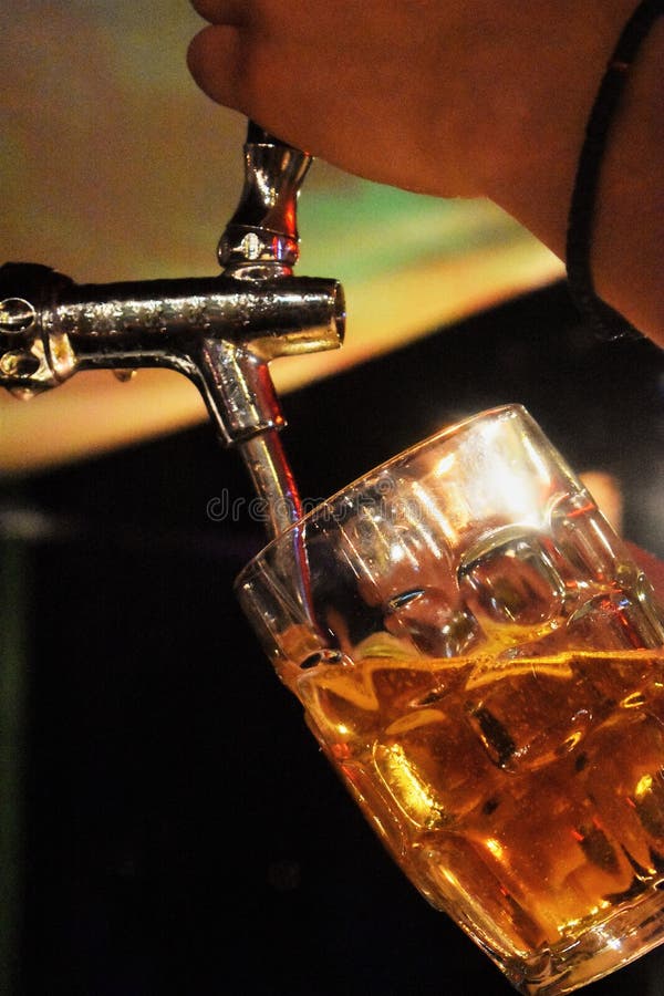 Pouring Beer from a Tap at Night Stock Photo - Image of fresh, glass ...