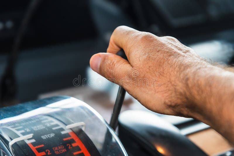 The Hand of an Operator Grips the Engine Telegraph Lever on the Bridge ...