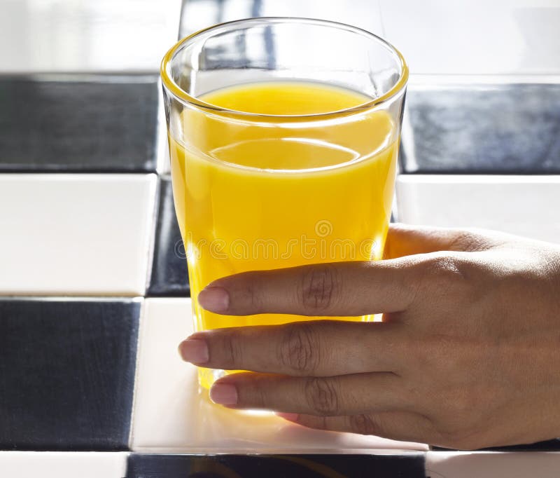 Hand with Orange Juice in Sunshine, Realistic Atmosphere Stock Image ...