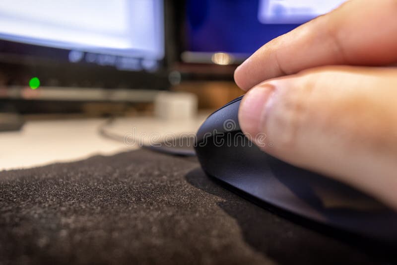 Hand Over Computer Mouse on a Mouse Pad Stock Photo - Image of scroll ...