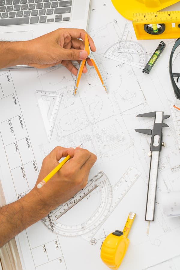 Hand Over Construction Plans with Yellow Helmet and Drawing Tool Stock ...