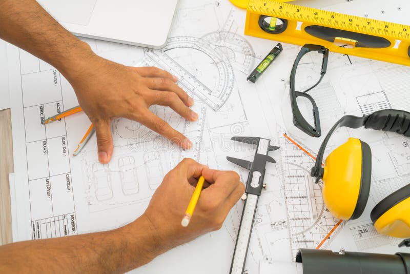 Hand Over Construction Plans with Yellow Helmet and Drawing Tool Stock ...