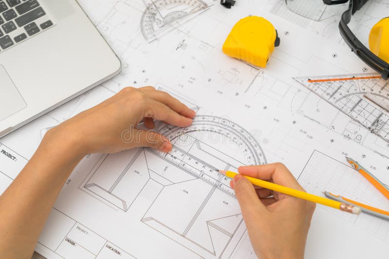 Hand Over Construction Plans with Yellow Helmet and Drawing Tool Stock ...