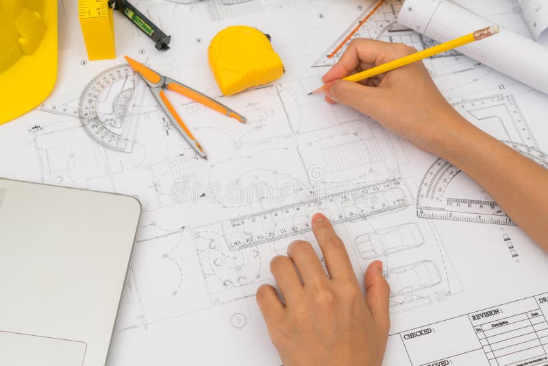 Hand Over Construction Plans with Yellow Helmet and Drawing Tool Stock ...