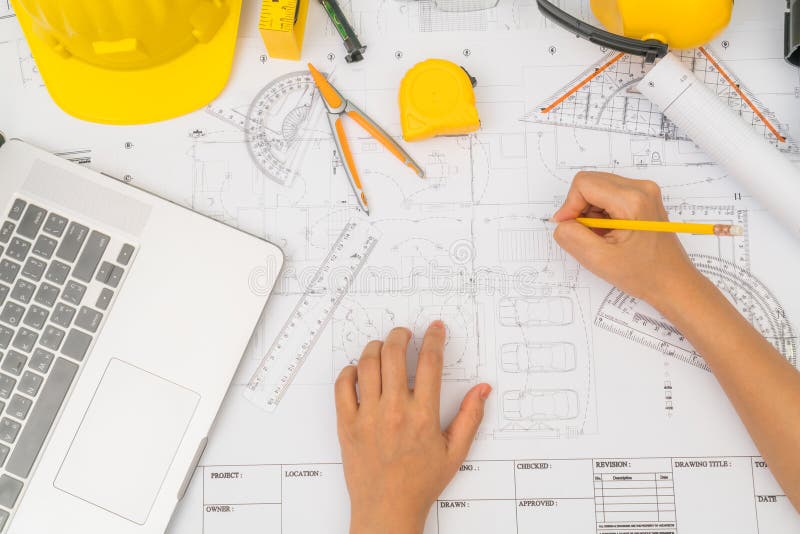 Hand Over Construction Plans with Yellow Helmet and Drawing Tool Stock ...