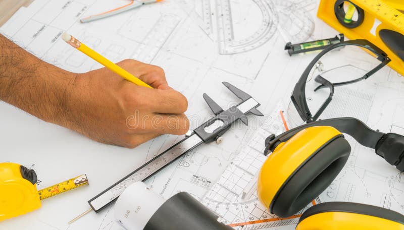 Hand Over Construction Plans with Yellow Helmet and Drawing Tool Stock ...