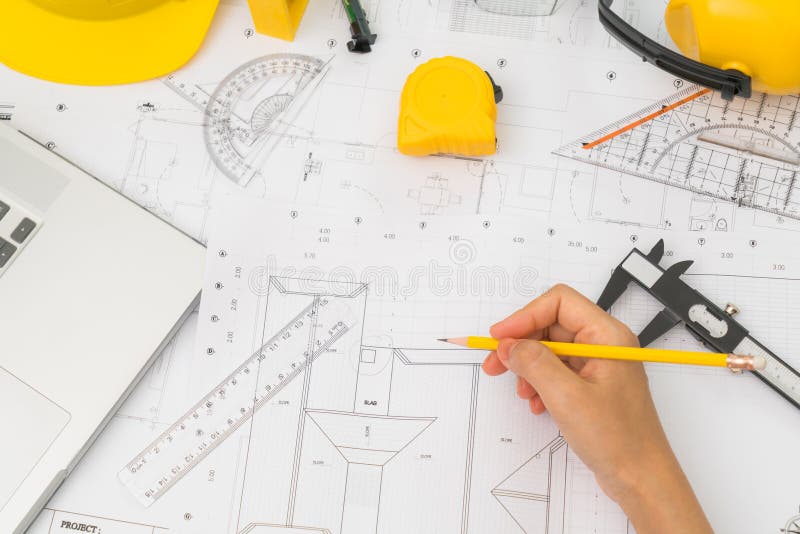 Hand Over Construction Plans with Yellow Helmet and Drawing Tool Stock ...