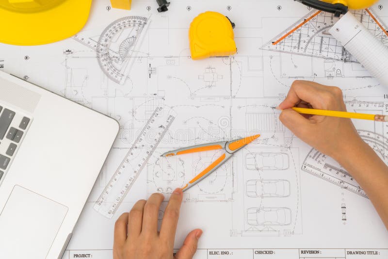 Hand Over Construction Plans with Yellow Helmet and Drawing Tool Stock ...