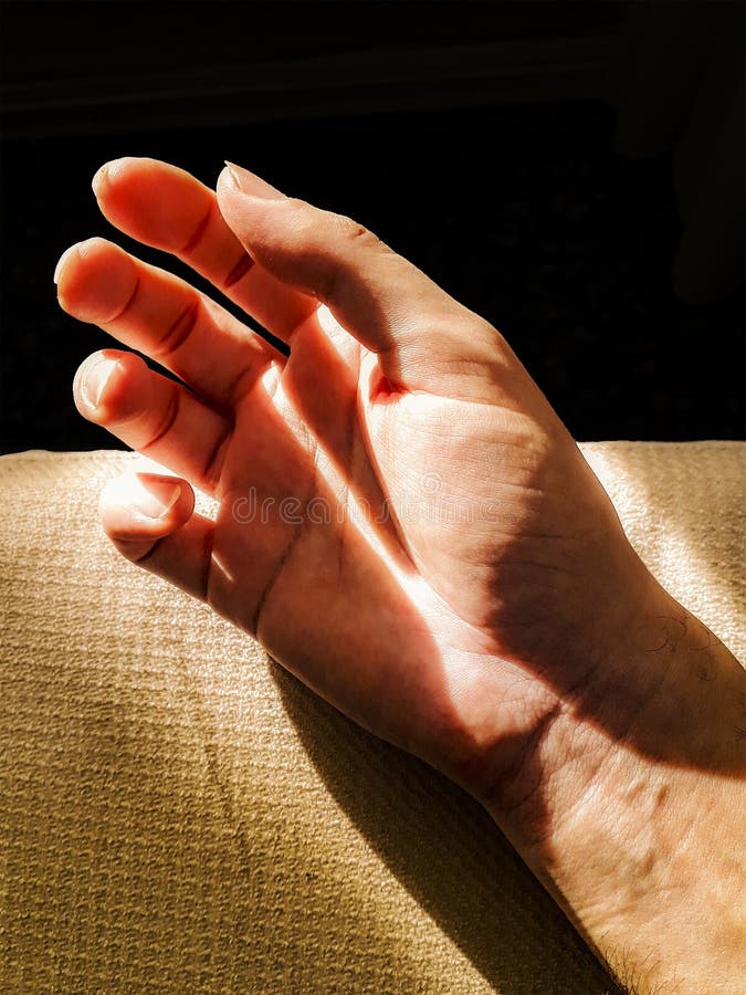 Hand Over Couch and Black Background Stock Image - Image of palm, parts ...