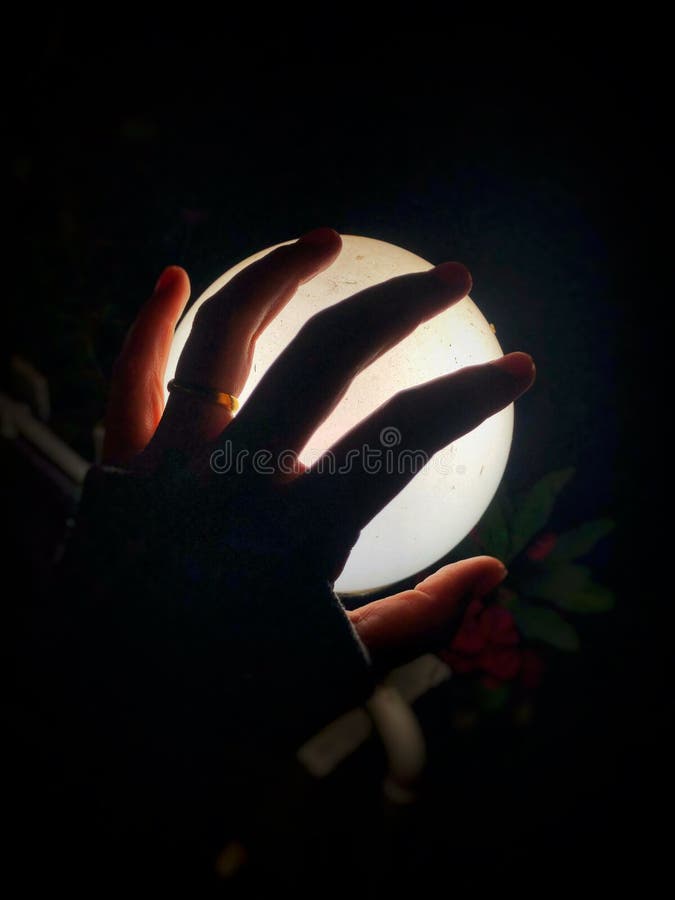 Hand over light stock image. Image of night, light, silhouette - 186147835