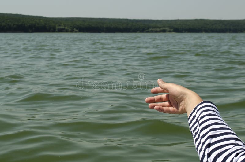 Hand over the river waves stock image. Image of hand - 74596595