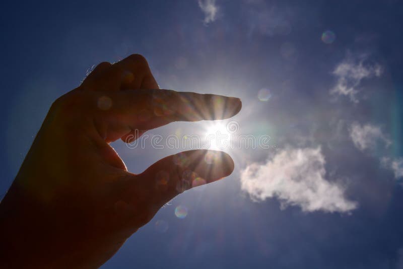 Hand over the Sky and Sun stock image. Image of silhouette - 123609877