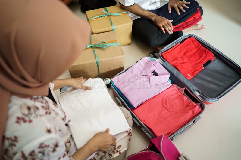 Hand packing on a suitcase stock photo. Image of home - 182262524
