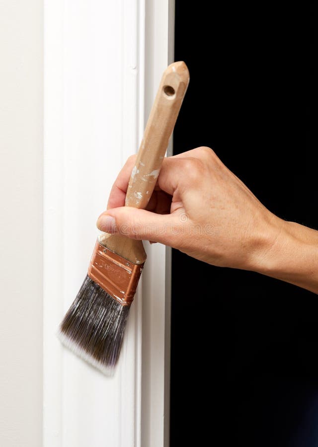 Hand with a paint brush. stock image. Image of fettler - 78236977