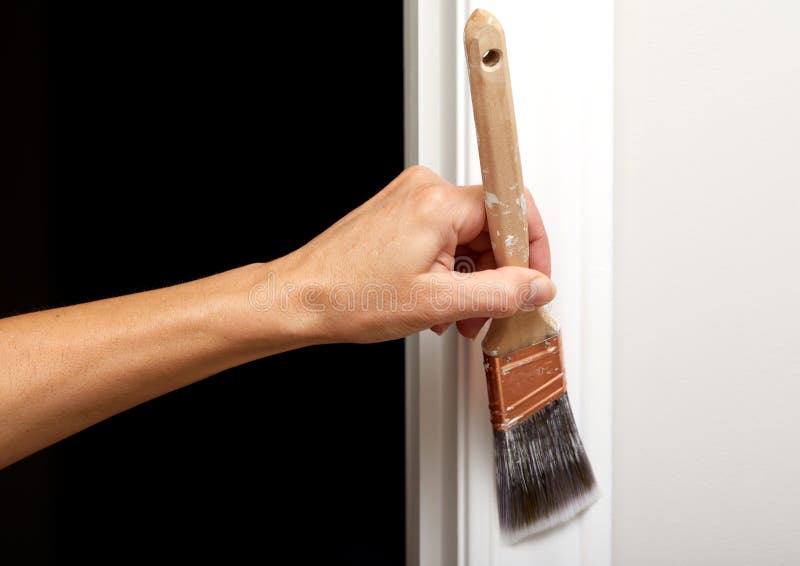 Hand with a paint brush. stock photo. Image of finishing - 78236982