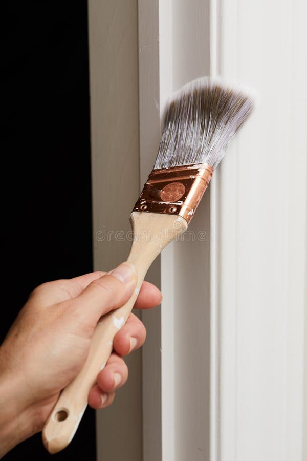 Hand with a paint brush. stock image. Image of painter - 78236987