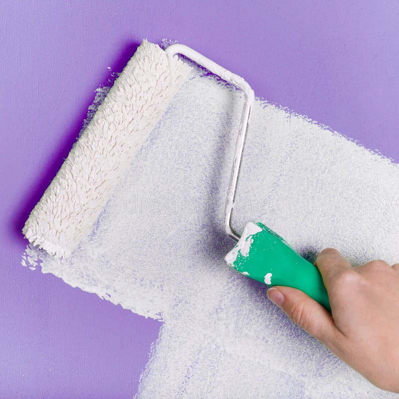Hand with paint roller stock photo. Image of design, hold - 37676854