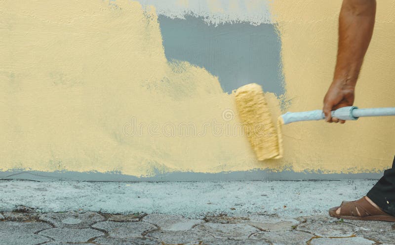 Hand with Paint Roller Painting an Outside Wall Stock Photo - Image of ...
