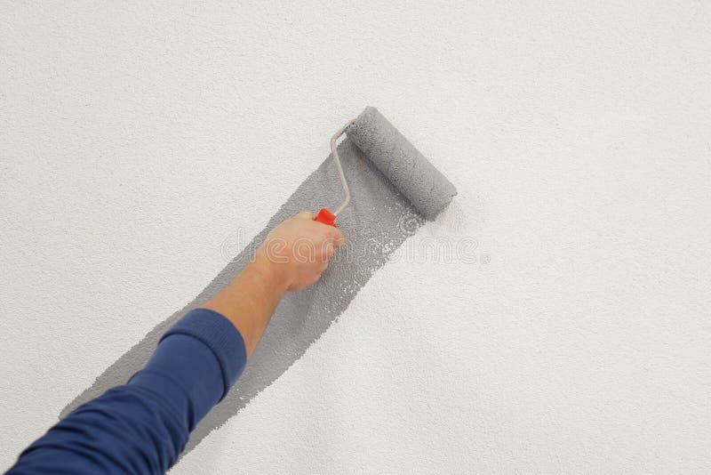Hand with Paint Roller in Hand, Painting a Wall Stock Image - Image of ...