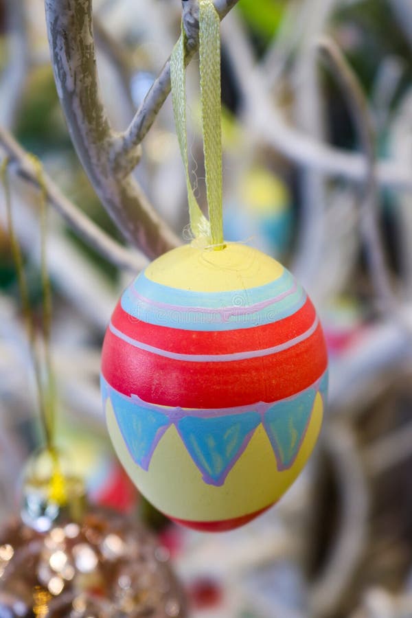 Hand Painted Easter Egg Hanging on a White Tree with Bokeh Background Stock Image - Image of ...