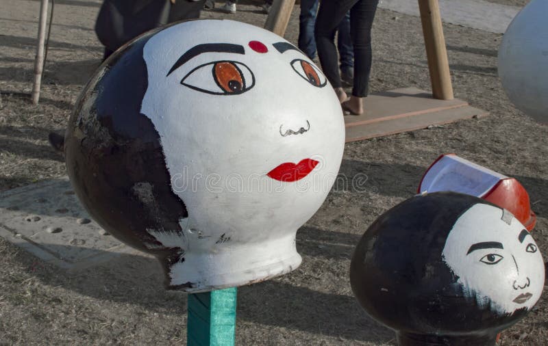 Hand Painted Faces on Clay Pitchers Stock Image - Image of earthenware ...