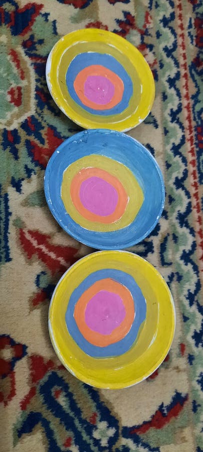 A Hand Painted Plates with Water Colours with Different Colours Stock ...
