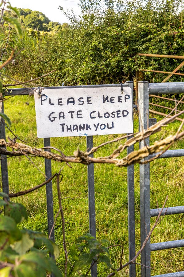 A Hand-painted Sign on a Weathered Gate Politely Requests Visitors To ...