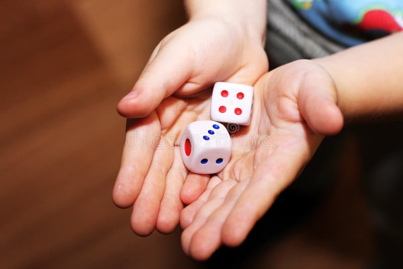 A hand with a pair of dice stock photo. Image of leisure - 101261728