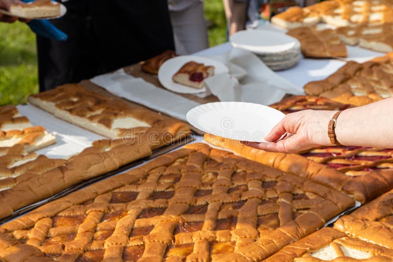 Hand with Paper Plate Reaches for Portion of Pie Stock Photo - Image of ...