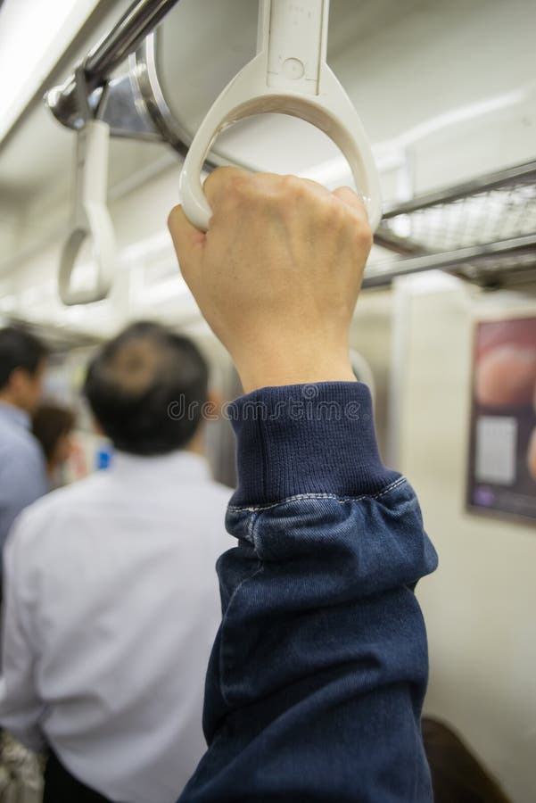 Hand of Passengers Hold on Rail Handle of Transit System Stock Photo ...