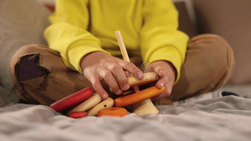 Hand Passes Toy Child. he Disassembles Pyramid Piece by Piece with His ...