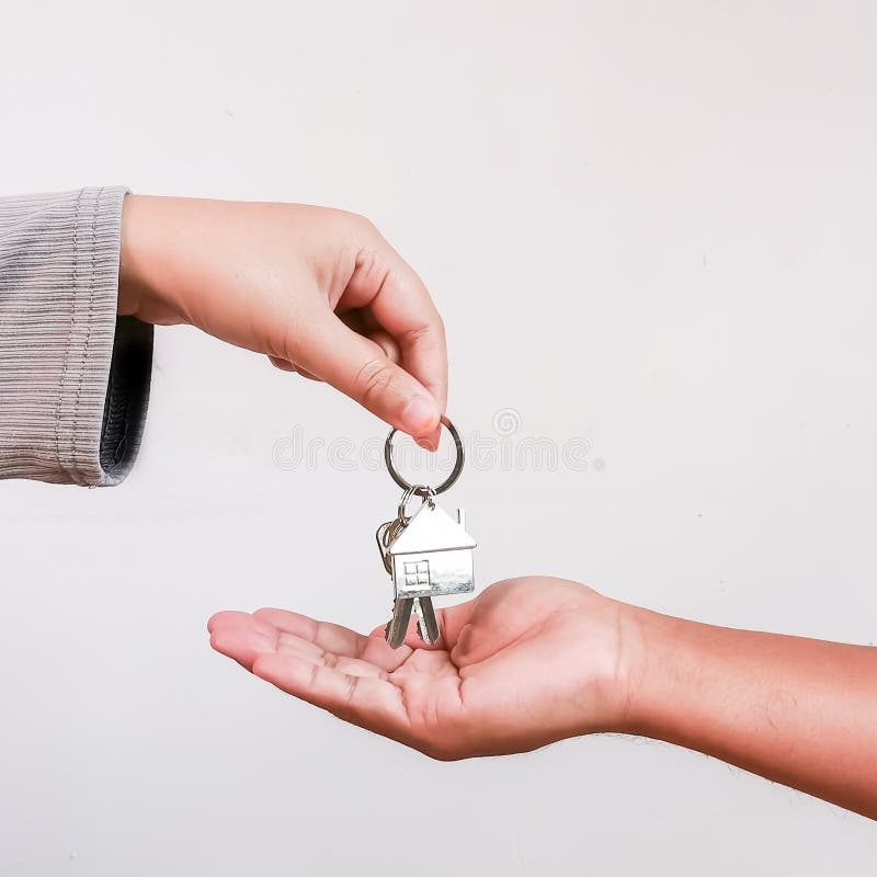 Hand Passing a Set of House Keys To Another Hand. Stock Photo - Image ...
